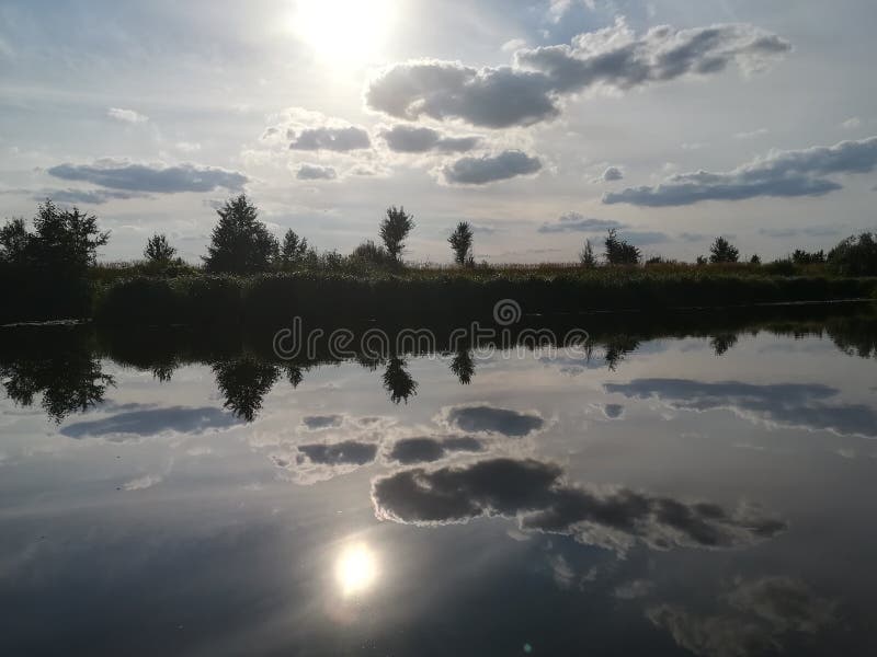 The Reflection of the Evening Summer Sun in the River Stock Photo ...