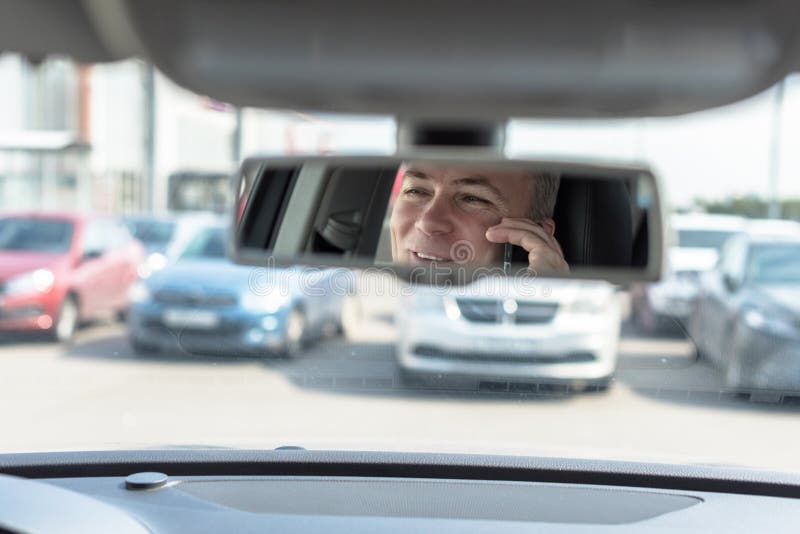 Reflection of Face of Middle Aged Man with a Serious Thoughtful Look in ...