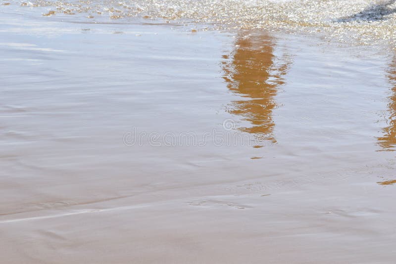Reflection of Feet on Sand by Sea. Sunny Shadow of Feet on Wet Sand ...