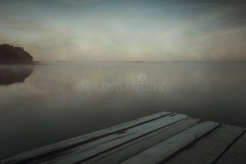 Reflection of the First Rays of Dawn Sunlight in the Lake. Stock Image ...