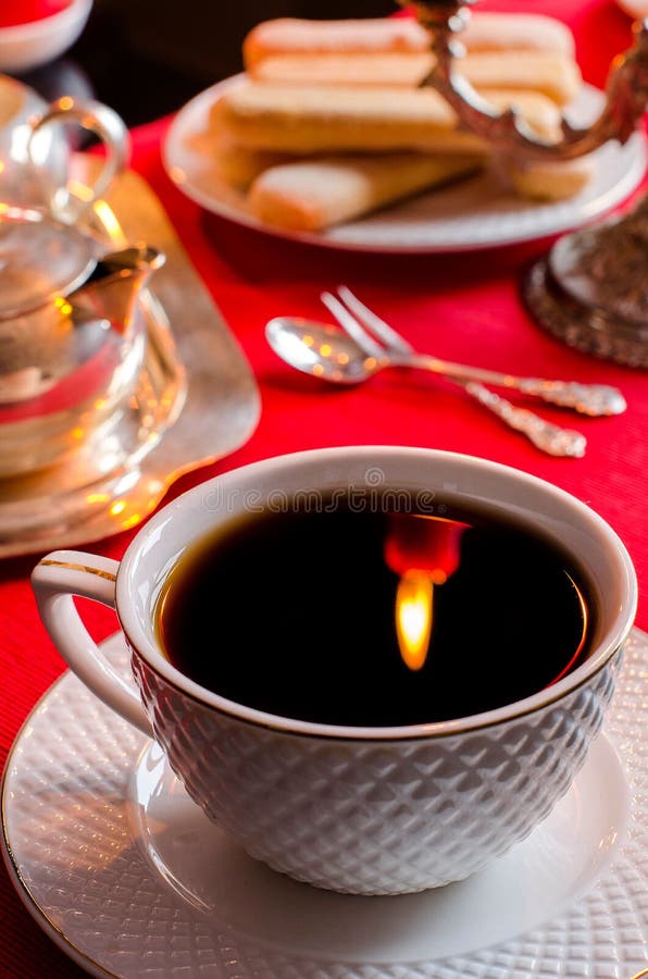 The Reflection of the Flame in a Cup of Tea Stock Photo - Image of ...