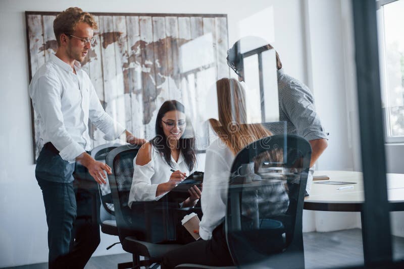 Reflection in the Glass. Young Business People in Formal Clothes ...