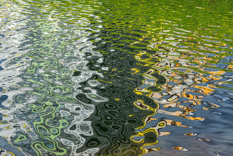 Reflection of High-rise Buildings in the Water of the Pond in Windy ...
