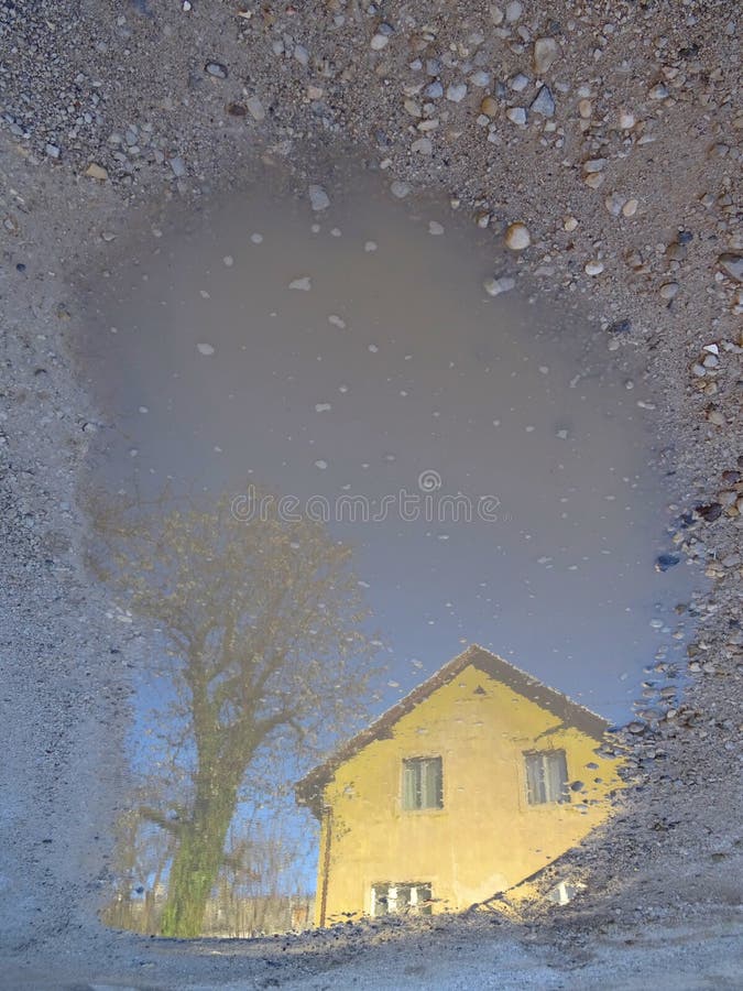 A Reflection of a House in a Puddle Stock Image - Image of house, rain ...
