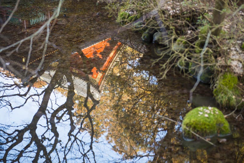 Reflection of Japanese Shrine in Water Stock Photo - Image of rock ...