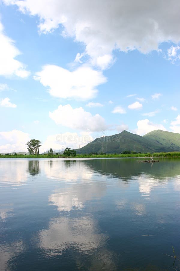 Reflection of the Kai Kung Leng, at Shan Pui Tsuen Fish Pond Stock ...