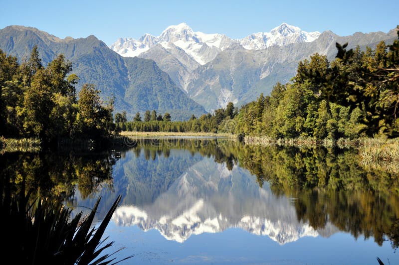 Reflection on Lake Matheson, New Zealand Stock Photo - Image of lake ...