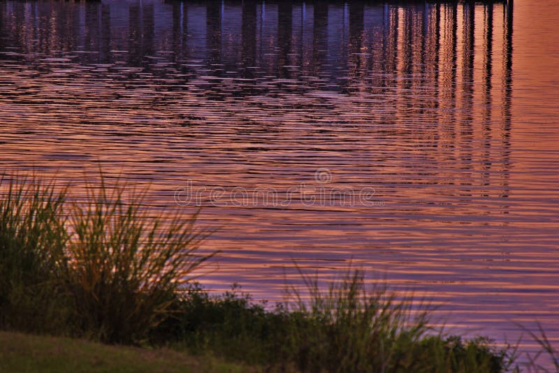 Reflection on lake water stock photo. Image of orange - 96542390