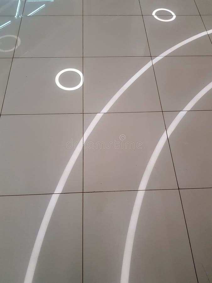 Reflection of Light Bulbs on White Tiled Floor Stock Photo - Image of ...