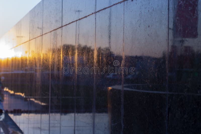 Reflection of Light on the Cladding. the Sunset Sun is Reflected in the ...