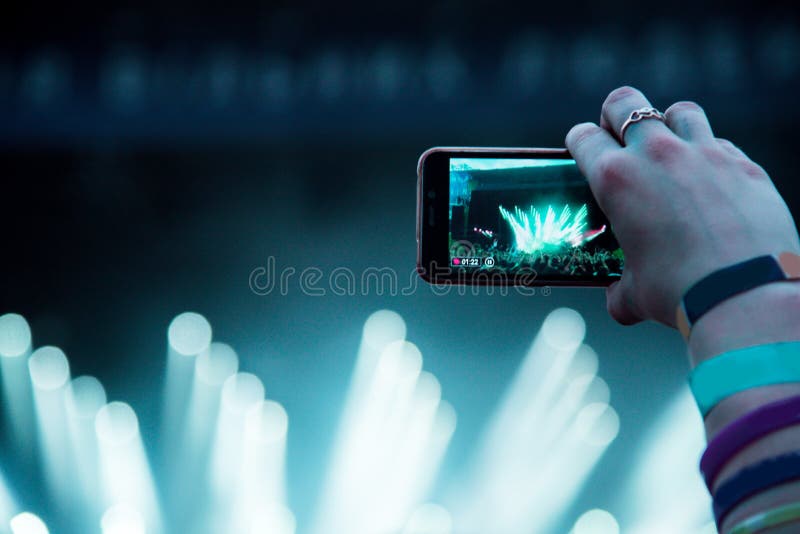 Reflection of Light Effects on Mobile Phone at a Concert (Gadge Stock ...