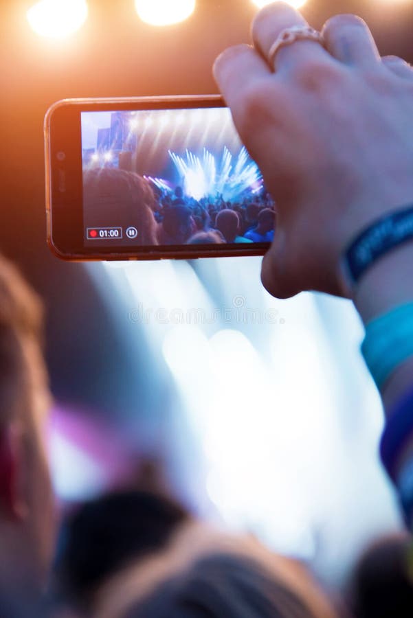 Reflection of Light Effects on Mobile Phone at a Concert (Gadge Stock ...