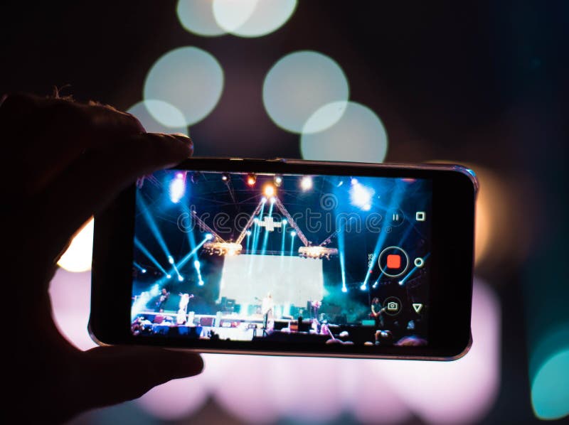 Reflection of Light Effects on Mobile Phone at a Concert (Gadge Stock ...