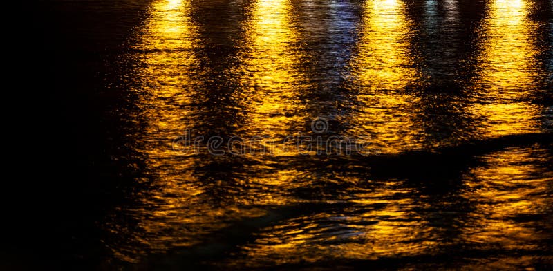 The Reflection of Light on Water at Night. Stock Image - Image of ...