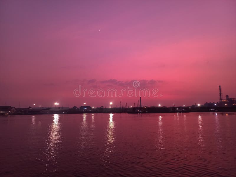 The Reflection of the Lights on the Coast at Sunrise is Very Beautiful ...