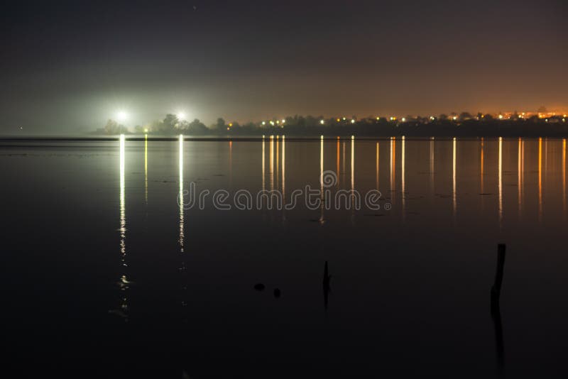 Reflection of a Luminous City in the Water at Night Stock Image - Image ...