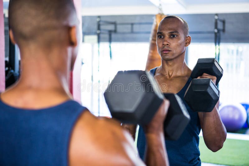 Reflection of Male Athlete Exercising with Dumbbell Stock Image - Image ...