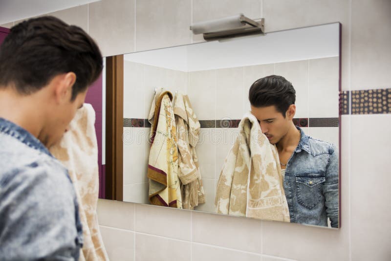 Reflection of Man Drying Face with Towel in Mirror Stock Photo - Image ...
