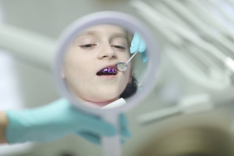 The Reflection in the Mirror of the Face of the Child Stock Photo ...