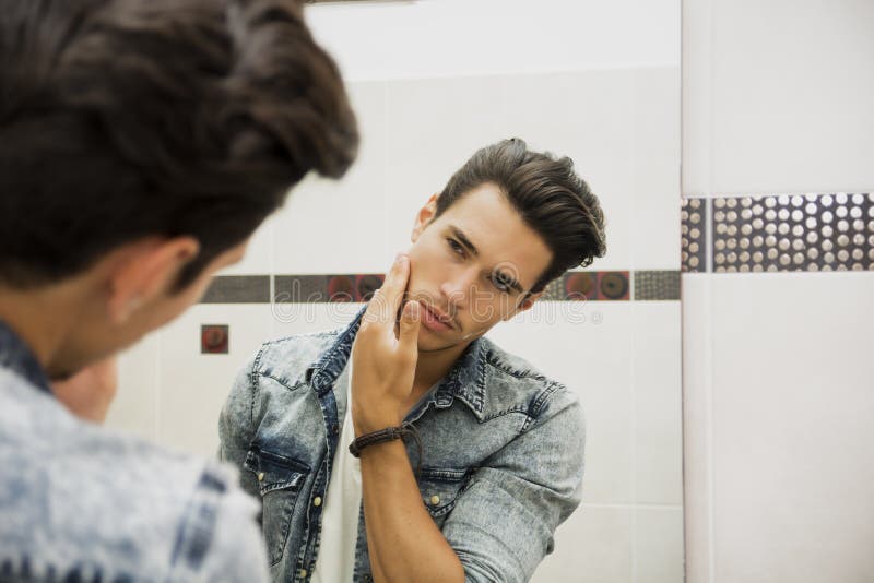 Reflection in Mirror of Man Touching Face Stock Photo - Image of people ...