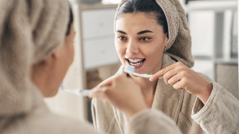 Reflection in a Mirror Young Woman Brushing Teeth Stock Image - Image ...