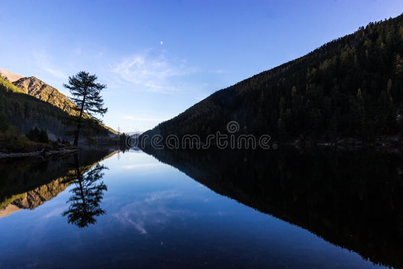 Reflection in Mountain Lake Stock Image - Image of rockies, mountains ...