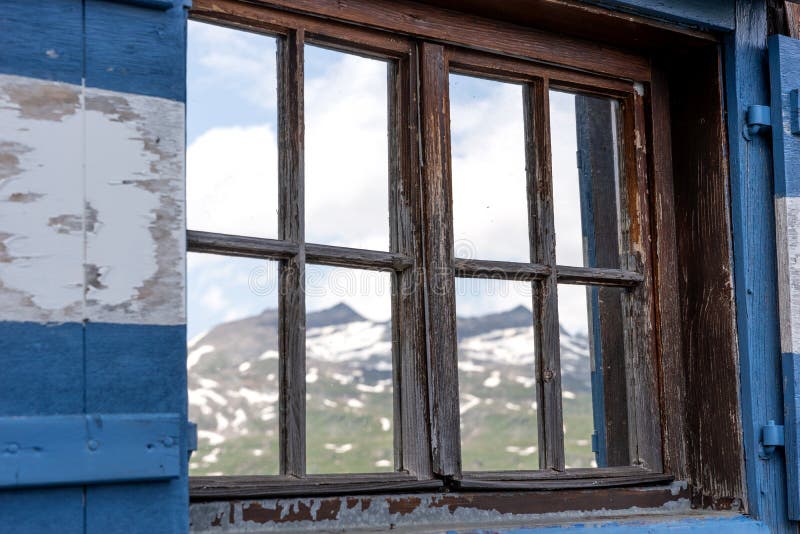 Reflection of Mountains in the Window. Open Traditional Window Shutters ...