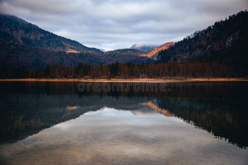Reflection of Mountainsides on the Surface of Freshwater on a Clouded ...