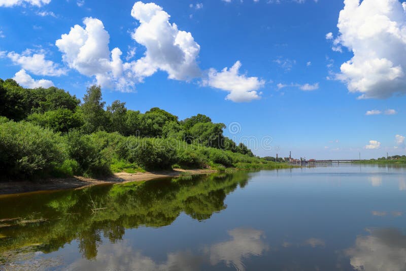 Reflection in the Neman River of Cumulus Clouds and the River Bank ...