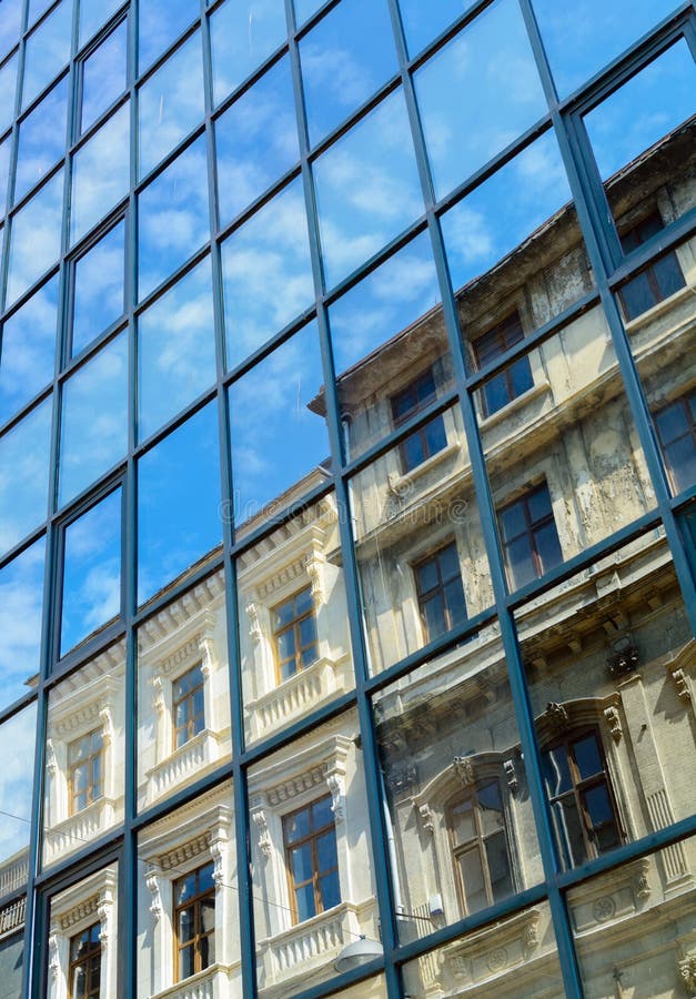Reflection of the Old House and the Sky with Clouds in the Windows the ...
