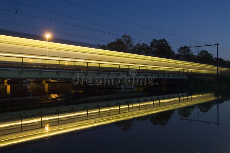 Reflection of a Passing Train Stock Photo - Image of twilight ...