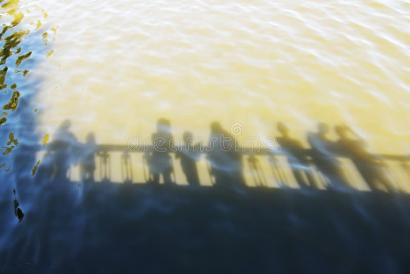 Reflection of People on the Water Stock Photo - Image of reflection ...