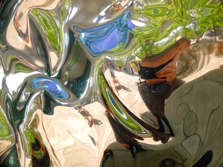 Reflection of a Photographer in a Distorting Mirror Stock Photo - Image ...