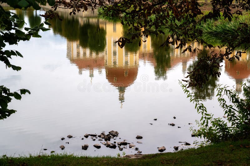 Reflection in the pond stock image. Image of trees, building - 352215741