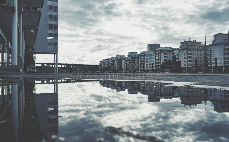 Reflection in Puddle in City during Day Stock Photo - Image of ...