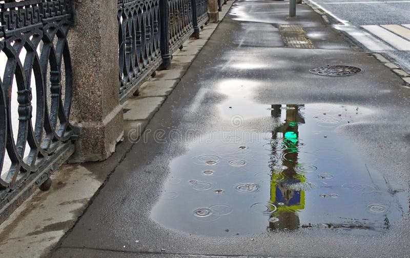 Puddle On The Sidewalk With Reflection Stock Image - Image of evening ...