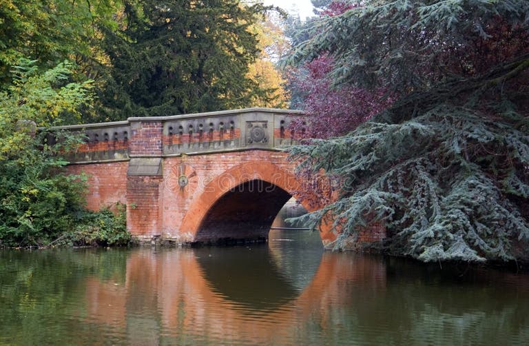 Reflection of a red bridge stock photo. Image of brick - 3460374