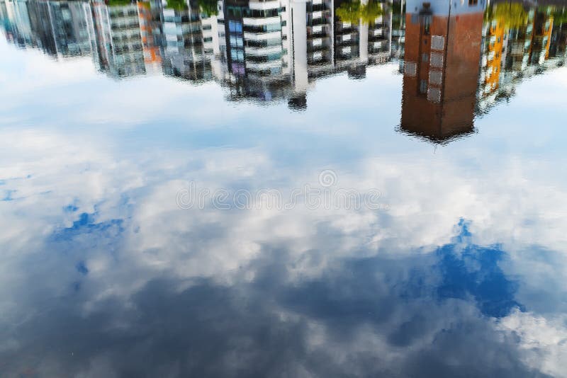 Reflection of Residential District Buildings on River Water Surface ...