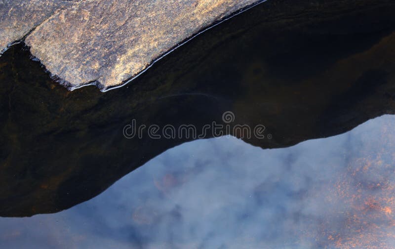 Reflection of Rocks and Sky Stock Photo - Image of nature, outdoor ...