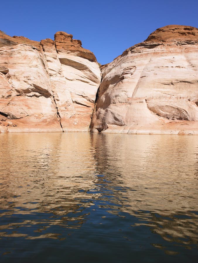 Reflection of Rocky Cliffs in Water Stock Photo - Image of calm ...