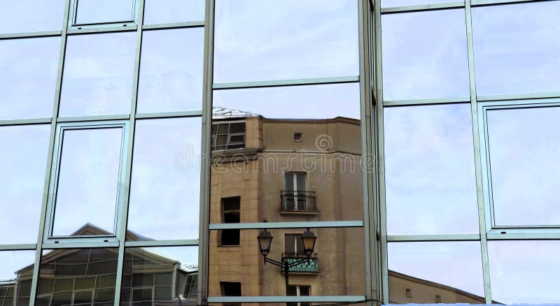 Reflection of the Roofs of Houses in the Mirror Windows of the Building ...