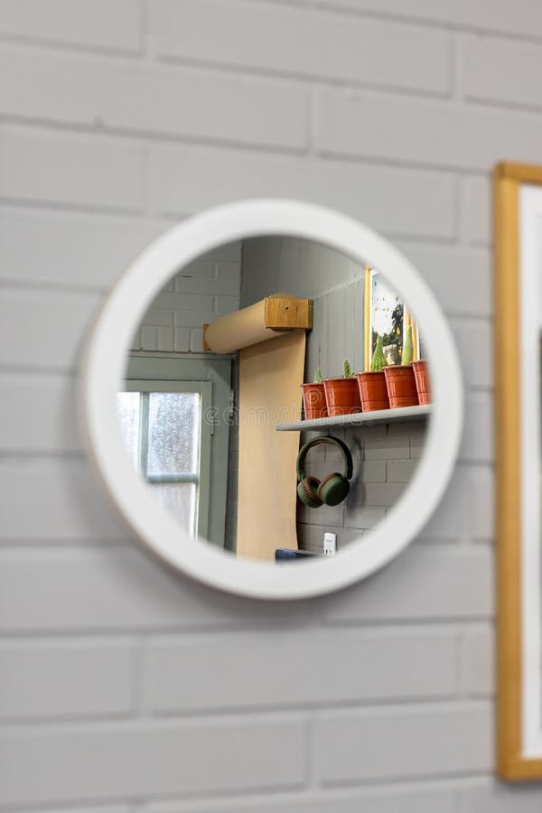 Reflection of the Room Interior on a Mirror with a Round Frame Stock ...