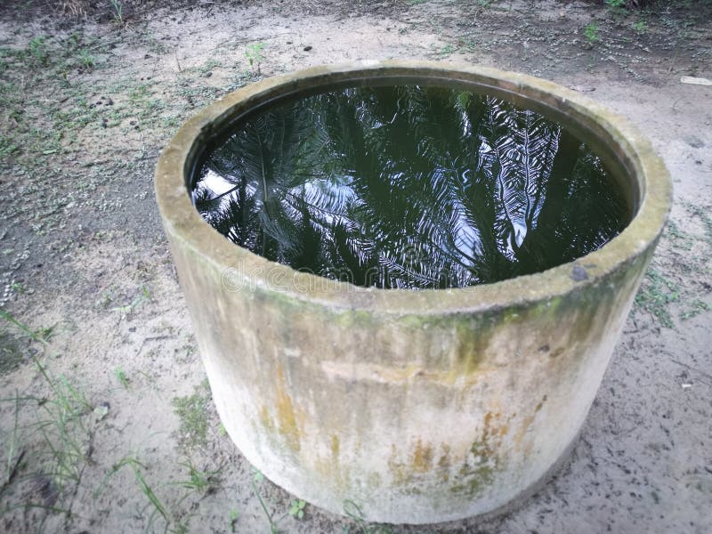 Reflection Scene on the Surface of the Concrete Well Fill with Water ...