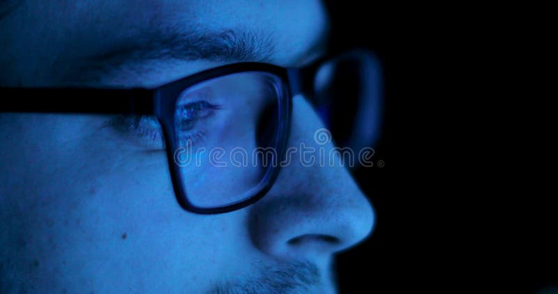 Reflection of the Screen in the Man`s Glasses in the Dark. Stock Video ...