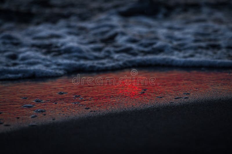 Reflection of the Setting Sun on the Beach Sand Stock Photo - Image of ...