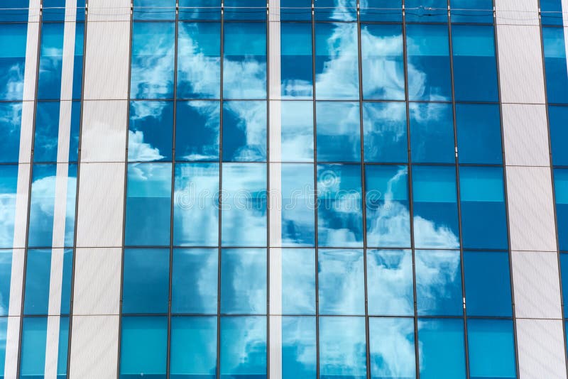 Reflection of the Sky and Clouds in Building Windows Stock Image ...