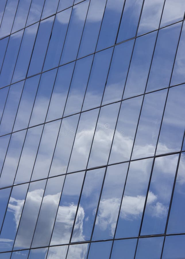Reflection of the Sky with Clouds in the Glass Windows of the Building ...