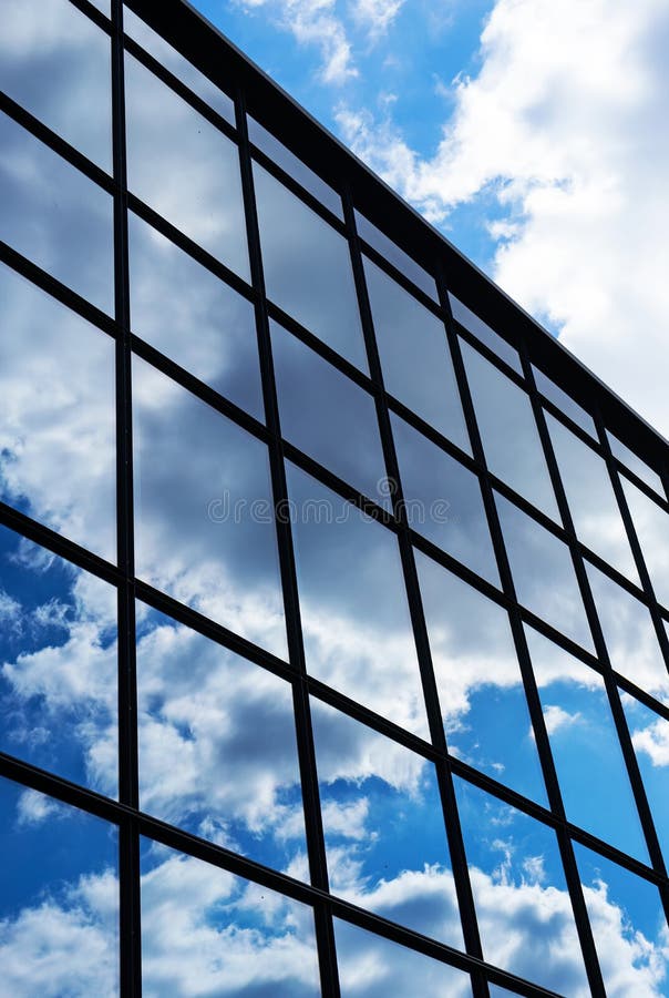 Reflection of the Sky and Clouds in the Windows of Building Stock Photo ...