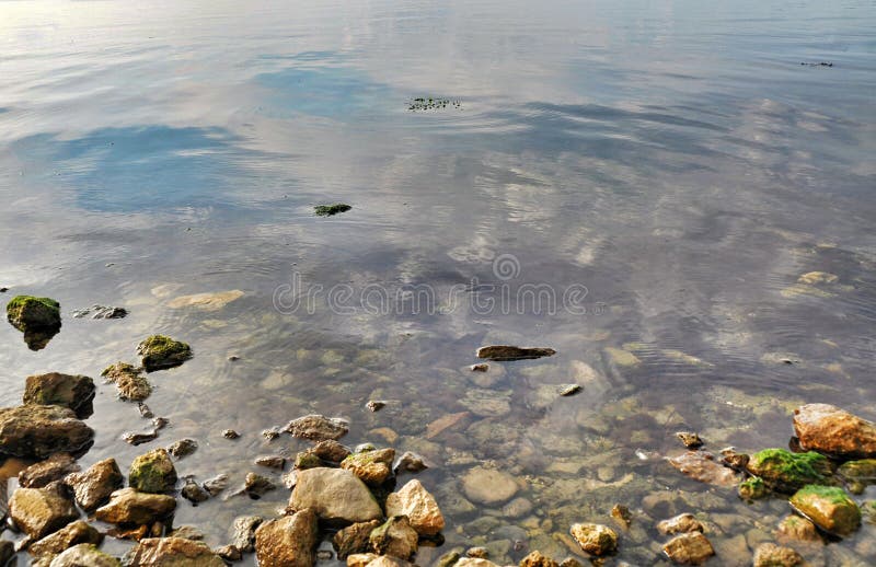 The Reflection of the Sky in the Mirrored Surface of the Sea Water ...