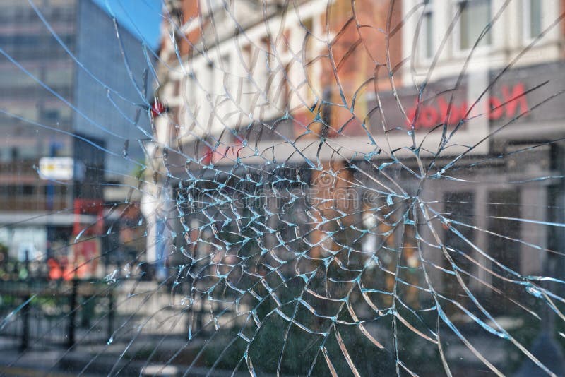 Reflection in Smashed Glass of Town Centre Window. Stock Image - Image ...